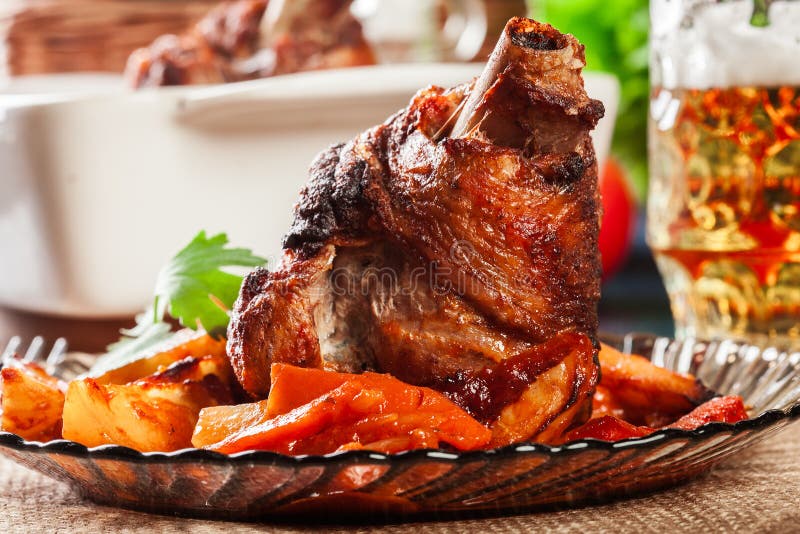 Roasted Turkey Knuckle with Potatoes and Vegetable Stock Image - Image ...