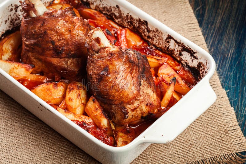 Roasted Turkey Knuckle with Potatoes and Vegetable Stock Photo - Image ...