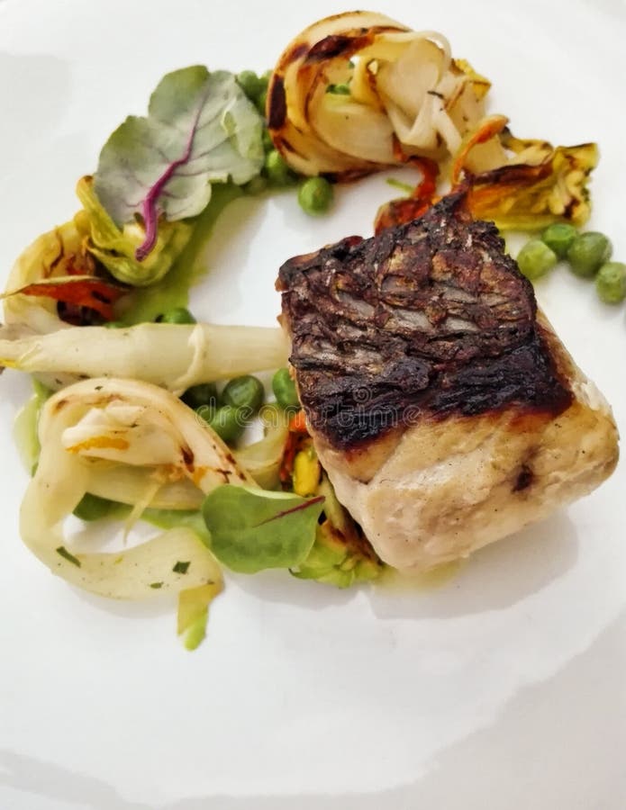 Roasted Veal Loin with Peas, Corn and Vegetables Stock Photo - Image of ...