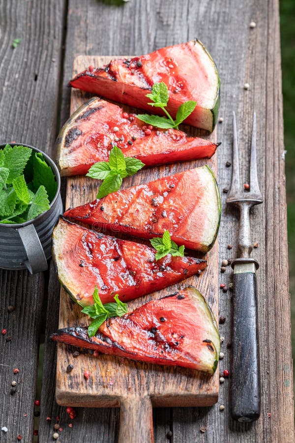 Roasted Watermelon with Red Pepper and Mint Stock Photo - Image of ...