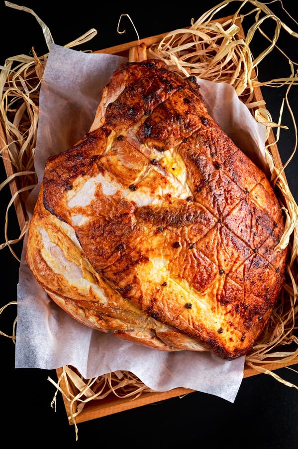 Roasted Whole Ham in Wooden Box with Straw. Top View Stock Photo ...