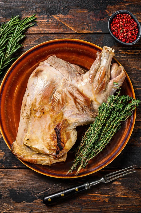 Roasted Whole Lamb Shoulder. Dark Wooden Background Stock Photo - Image ...