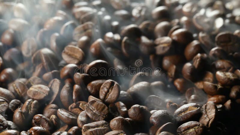 Coffee Beans Rotate on a Black Studio Background with Burning Tongues ...