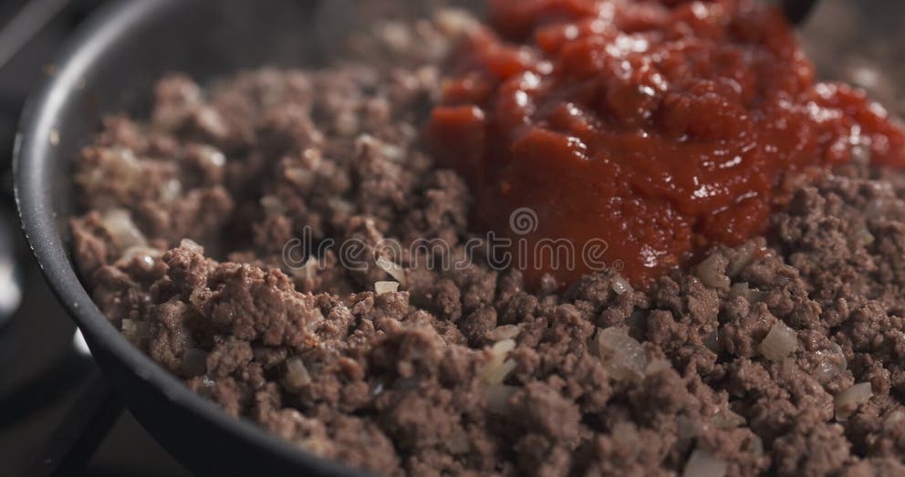 Roasting Minced Beef with Tomato Paste in a Pan Stock Photo - Image of ...