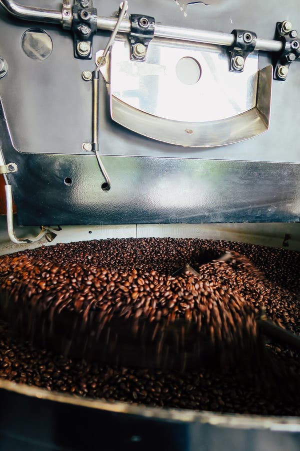 Roasting process of coffee stock image. Image of factory - 230733573