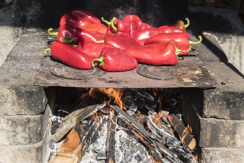 Roasting red bell peppers stock photo. Image of grill - 260393692
