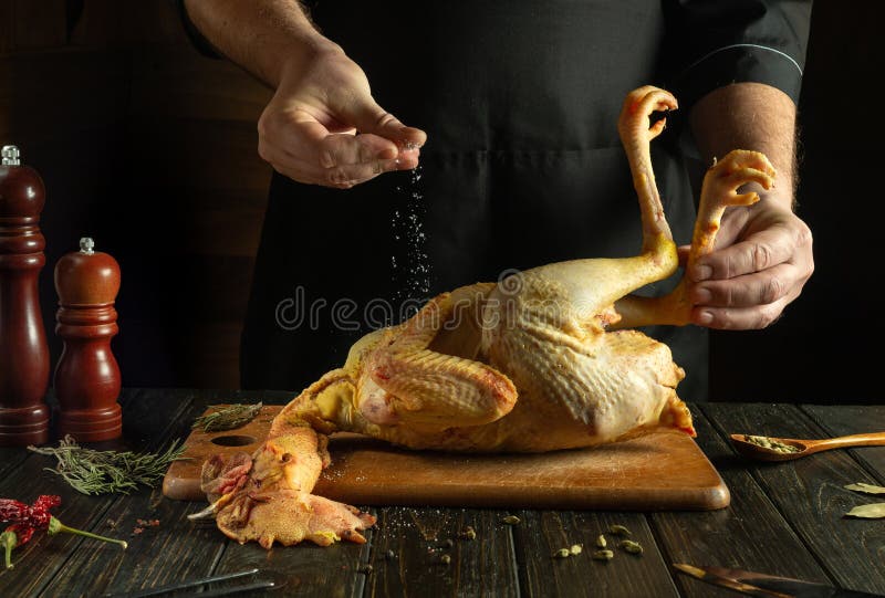 Before Roasting, the Rooster Must Be Salted. the Cook Adds Salt To Raw ...