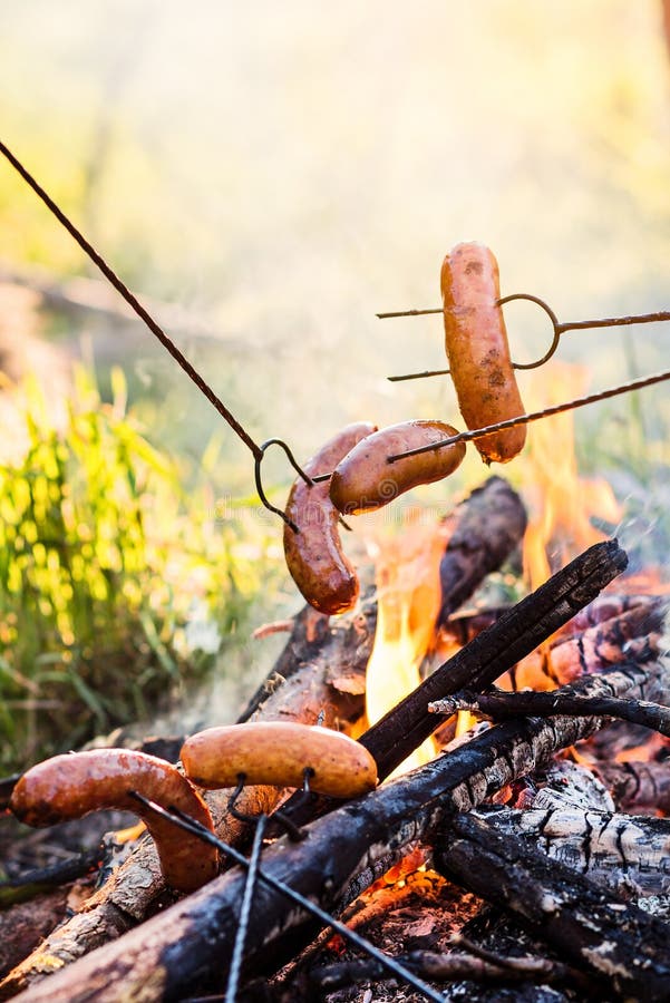 Roasting Sausages on Campfire Stock Photo - Image of fire, outdoor ...