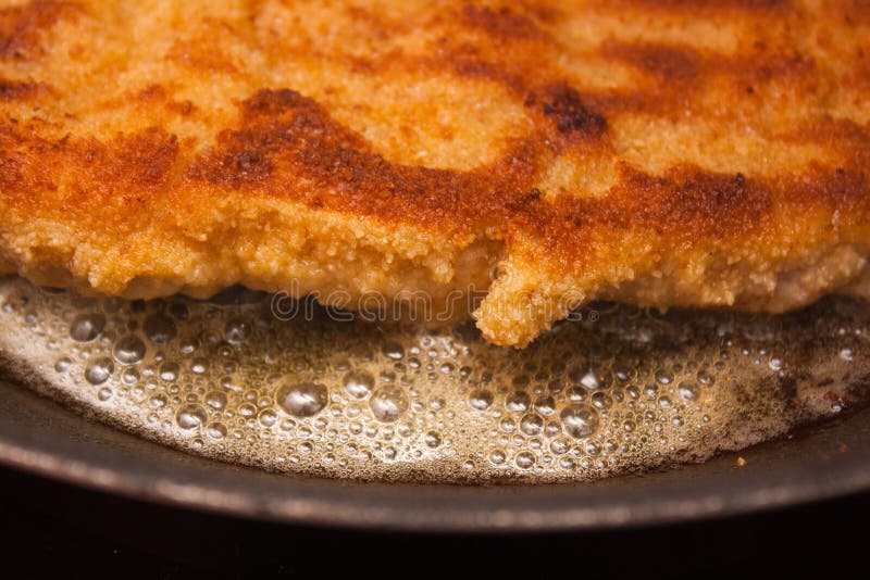 Roasting a Wiener Schnitzel in a Pan Stock Photo - Image of brown, gold ...