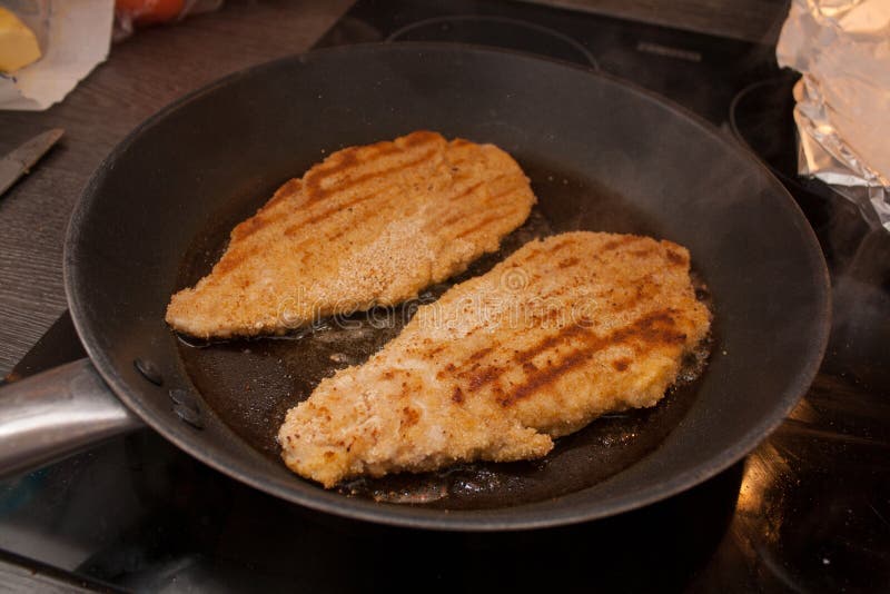 Roasting a Wiener Schnitzel in a Pan Stock Photo - Image of roasting ...