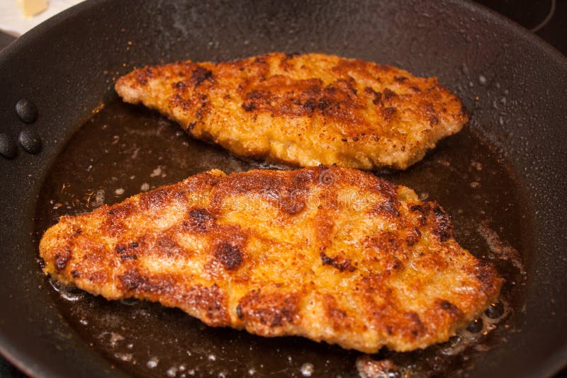 Roasting a Wiener Schnitzel in a Pan Stock Image - Image of homemade ...