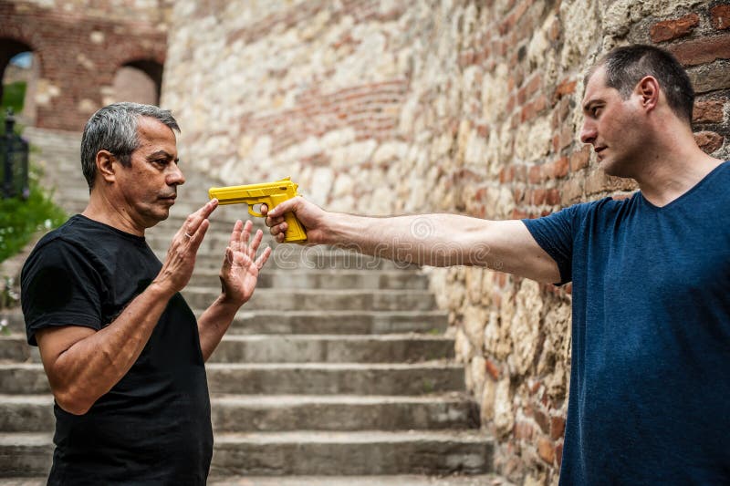 Robber with a Gun Attacks the Victim. Gun Point Stock Image - Image of ...
