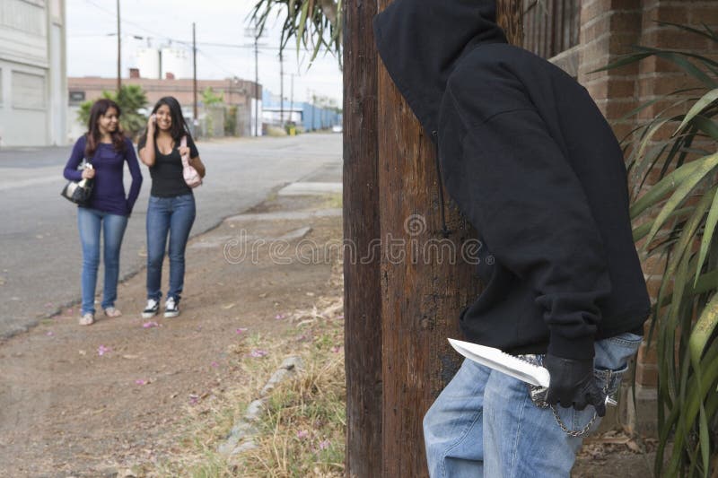 Robber Hiding Behind Tree and Waiting for Two Girls Stock Photo - Image ...