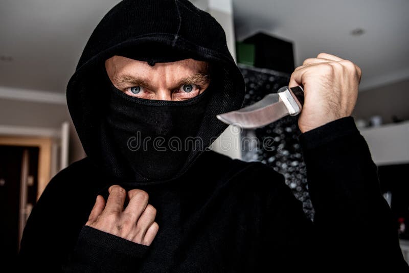 Robber, Murderer or Killer with Knife. Concept of Danger Stock Photo ...
