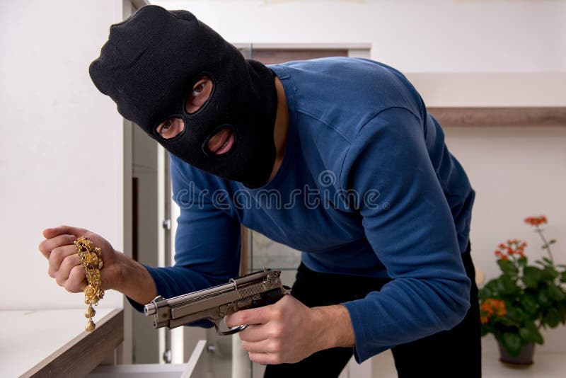 Male Robber Stealing Valuable Things from the House Stock Photo - Image ...