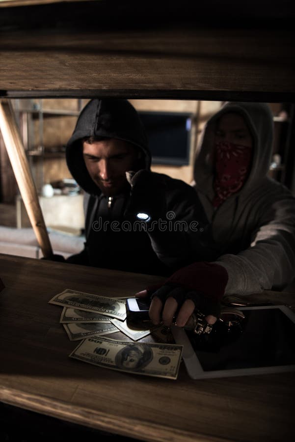 Robbers stealing money stock photo. Image of devices - 93100618