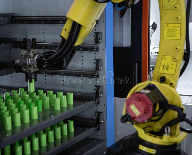 Robot Arm Loading Workpieces on CNC Lathe Machine Stock Photo - Image ...
