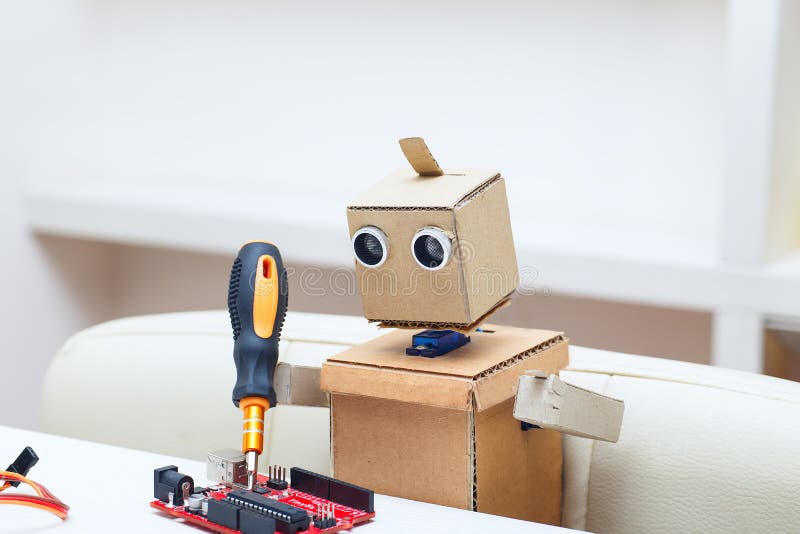 Robot with Arms Solder Red Chip on the Table Stock Photo - Image of ...