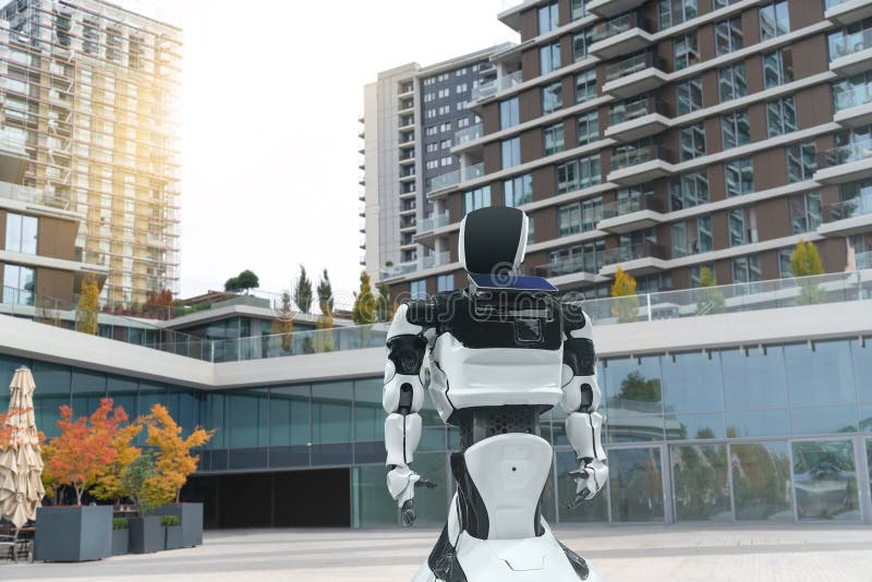 Robot Assistant Walking in Front of Building. Stock Image - Image of ...
