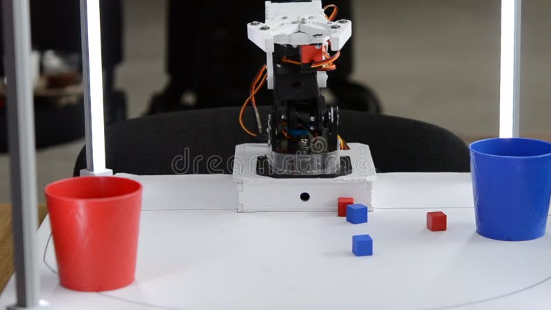 Robot Automatic Hand Taking Cubes and Putting in Glass. Automatic ...