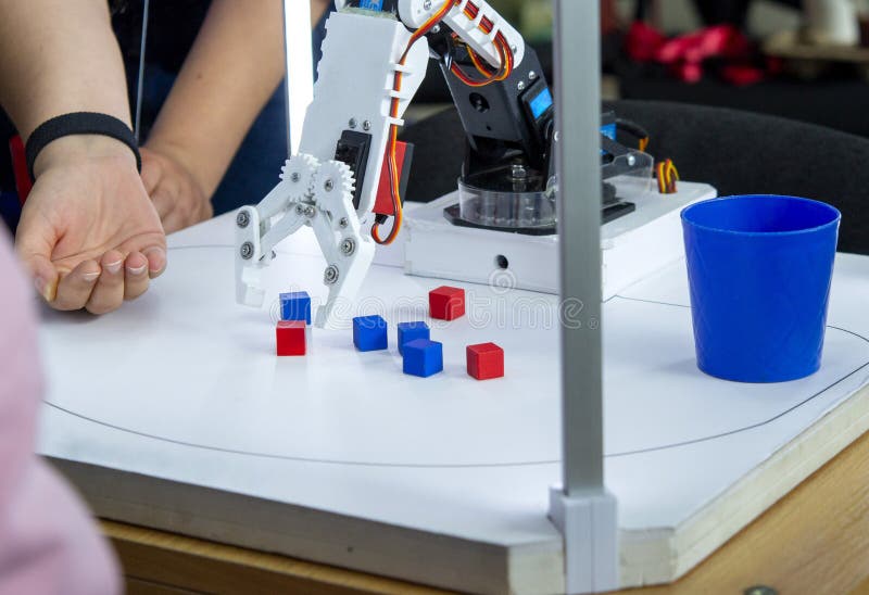 Robot Automatic Hand Taking Cubes and Putting in Glass. Automatic ...