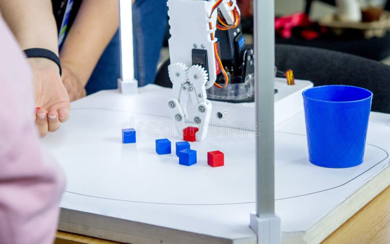 Robot Automatic Hand Taking Cubes and Putting in Glass. Automatic ...