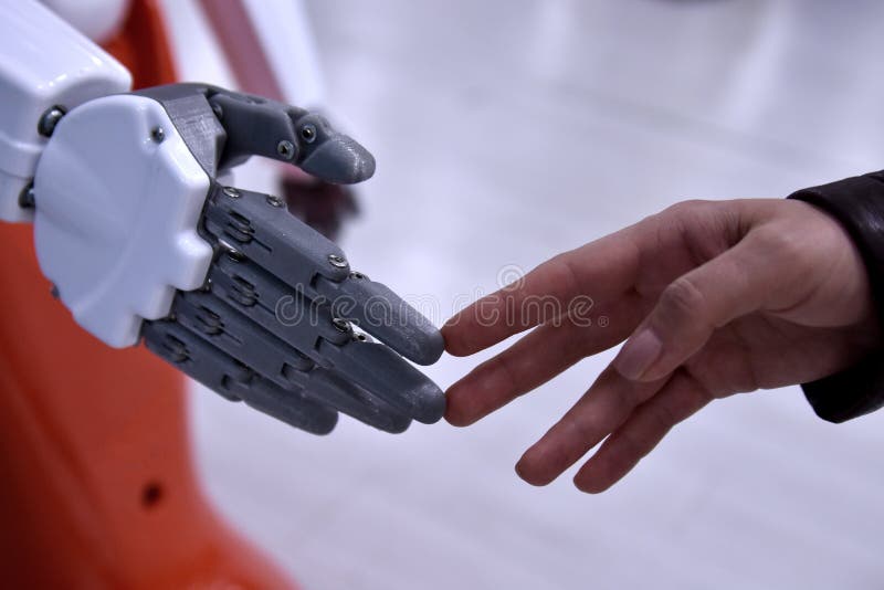 Robot and human hand stock image. Image of artificial - 232976013
