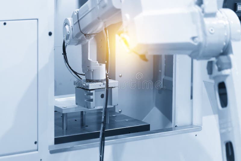 The Robot in Modern CNC Machine Operation. Stock Image - Image of ...