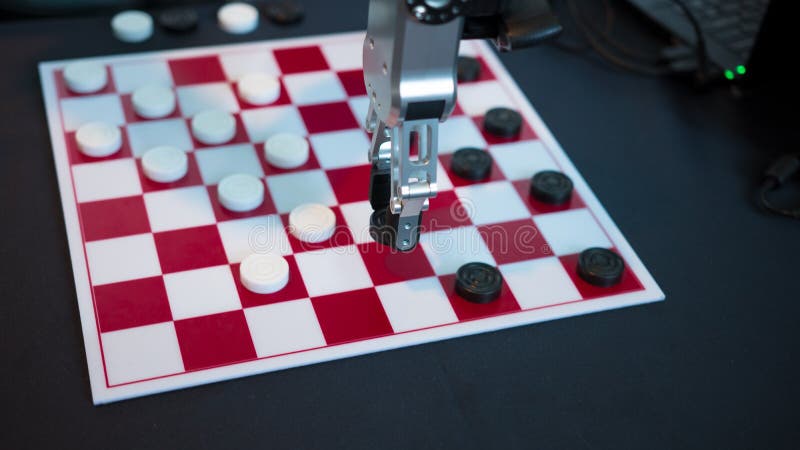 Robot Playing Checkers. Hand Manipulator Moves Checkers. Stock Photo ...