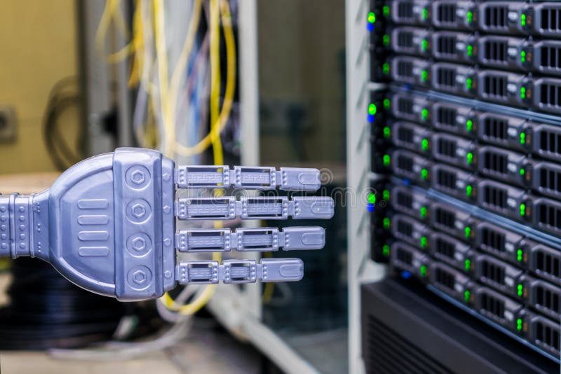 The Robot`s Hand is in the Server Room of the Data Center. the Concept ...