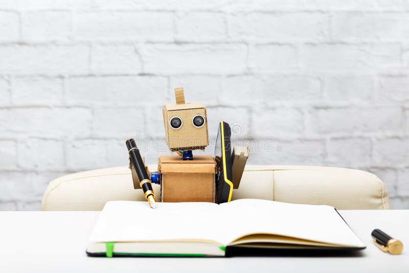 Robot is Sitting at the Table and Talking on the Phone Stock Image ...