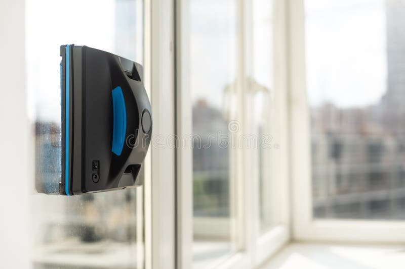 Robot Window Cleaner Work on Dirty Window. Cleaning the House with ...