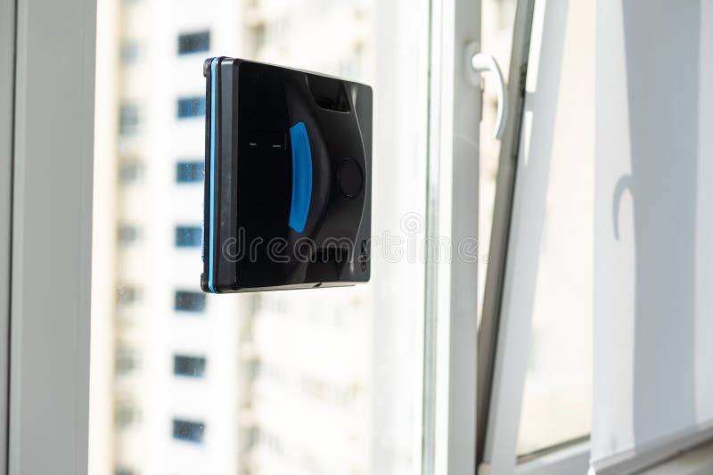 Robot Window Cleaner Work on Dirty Window. Cleaning the House with ...