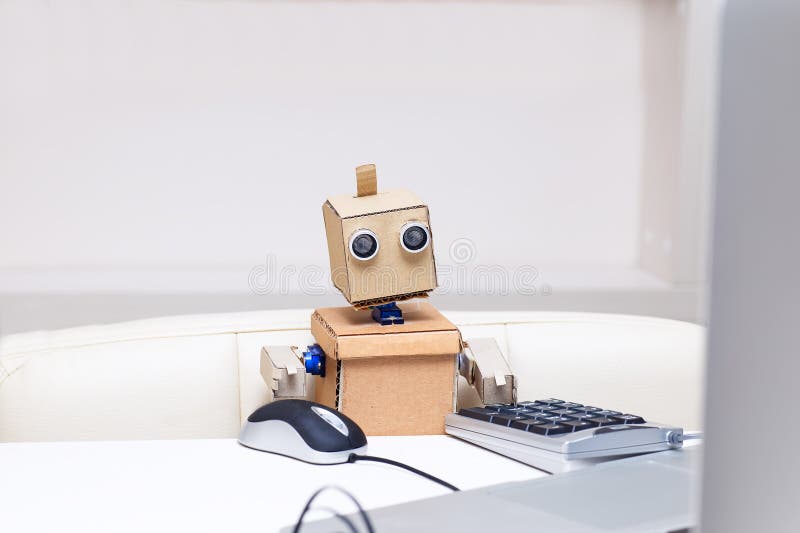 Robot Working at a Computer and Used E Mouse at the Table Stock Photo ...