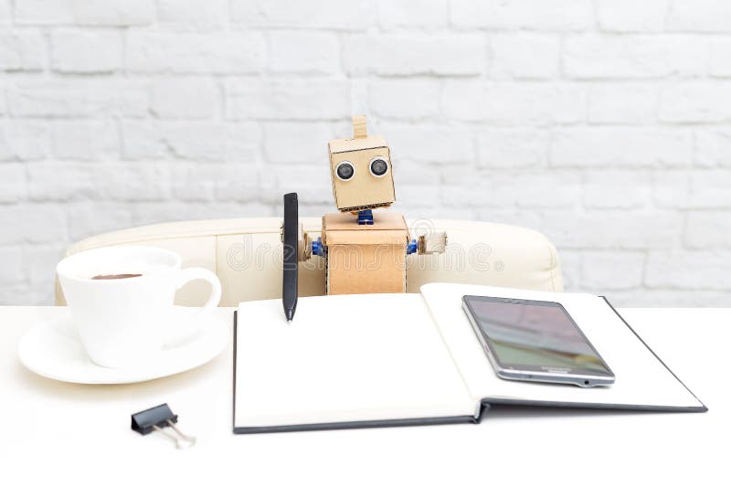 Robot Writes a Pen in Diaries. Artificial Intelligence Stock Photo ...