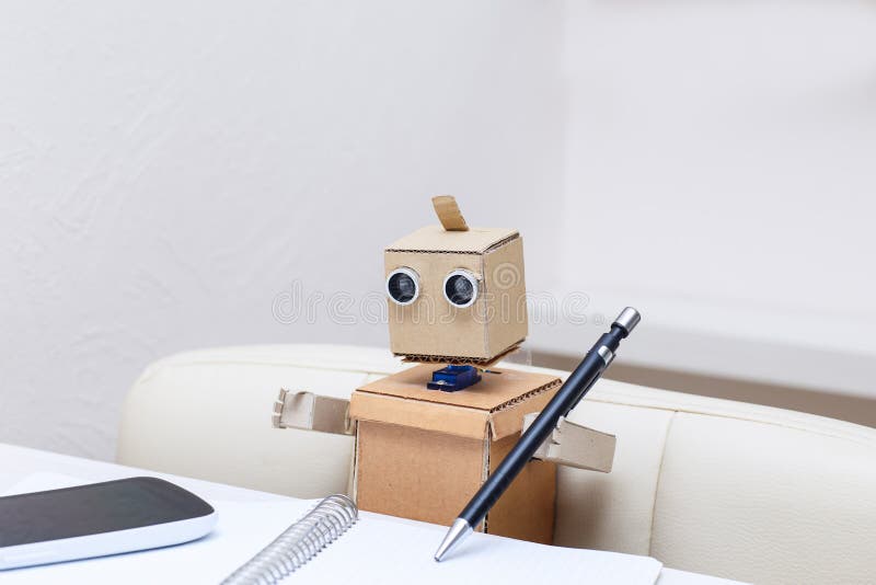 Robot Writes a Pen in Diaries. Artificial Intelligence Stock Photo ...