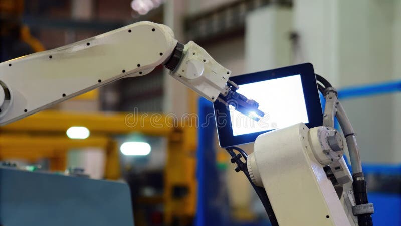 A Robotic Arm on an Assembly Line Receiving Remote Instructions Via ...