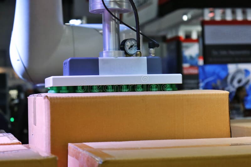 Robotic Arm Carrying Carton Box on Conveyor Belt in Smart Distribution ...