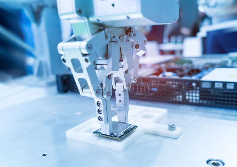 Robotic Arm Installing a Computer Chip Stock Photo - Image of metal ...