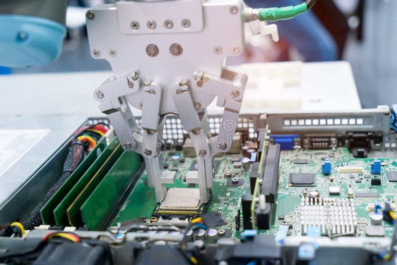 Robotic Arm Installing a Computer Chip Stock Image - Image of equipment ...