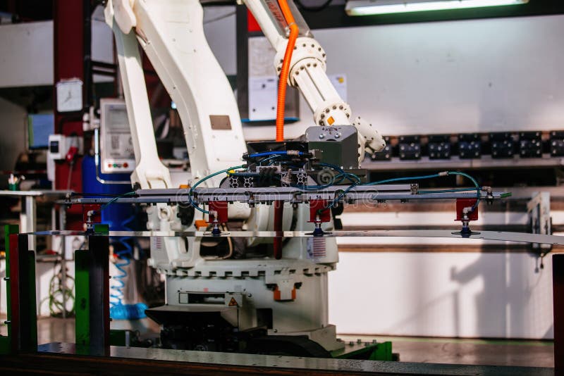 Robotic Arm Working with Metal Sheet at Hydraulic Bending Machine Stock ...