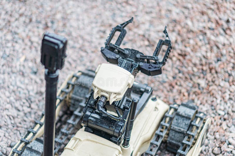 A Robotic Exploration Vehicle is Shown on an Outdoor Surface, Equipped ...