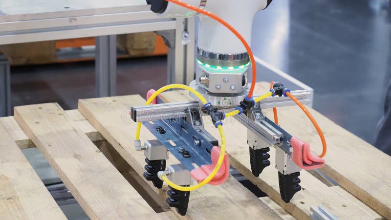 A Robotic Gripper with Pneumatic Components Handling a Wooden Pallet ...