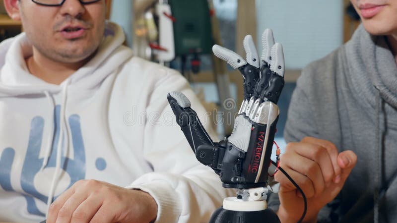Man Assembling Innovative Cybernetic Bionic Arm. Hi-tech Innovative ...
