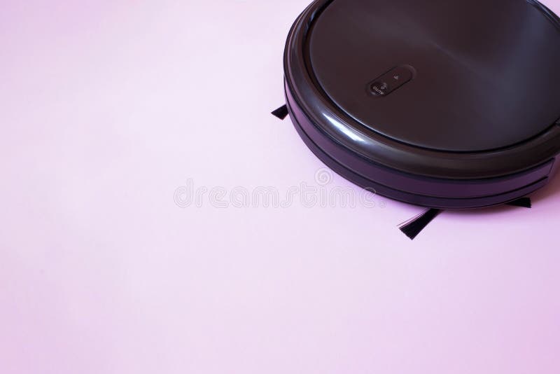 Robotic Vacuum Cleaner. Close-Up of Autonomous Robot on Pink Background ...