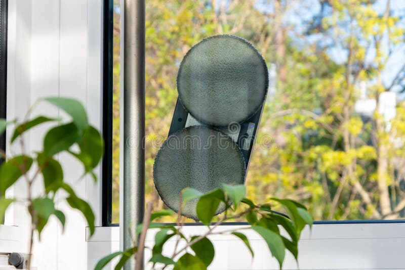 The Robotic Window Cleaner Works on a Glass Surface. Stock Photo ...