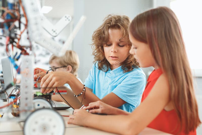 Robotics. Children Sitting Having Class Working on Robot Concentrated ...
