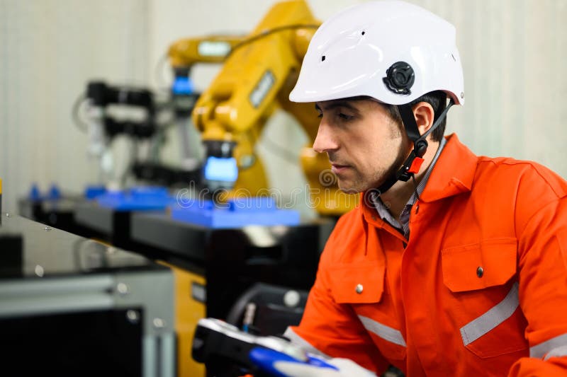 Robotics Controller Engineer Working and Solving Problems on Machine ...