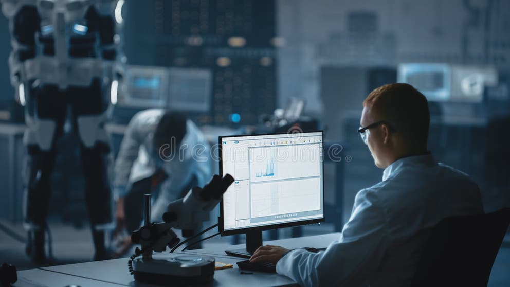 In Robotics Development Laboratory: Chief Analyst Uses Computer, Top ...