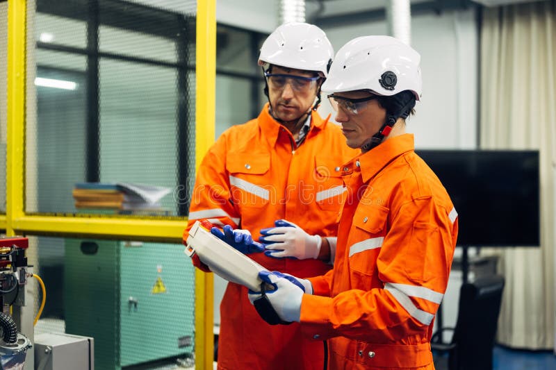 Robotics Engineers Team Discussing and Solving Problems Stock Photo ...